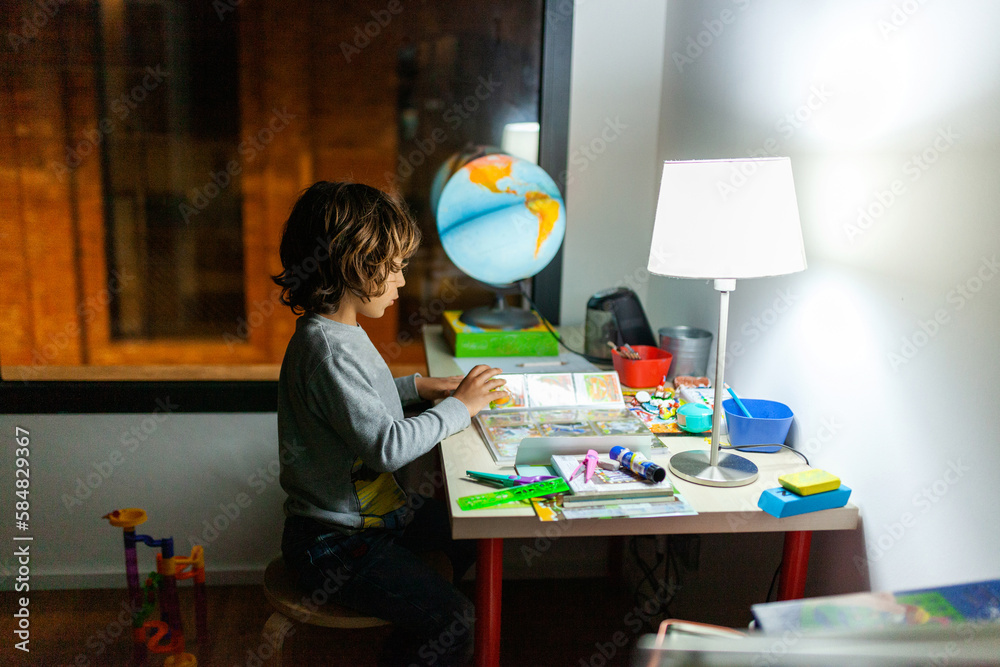 Kid Studying At Night Stock Photo | Adobe Stock