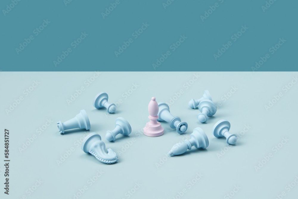 Pink bishop and fallen blue chess pieces. Stock Photo | Adobe Stock