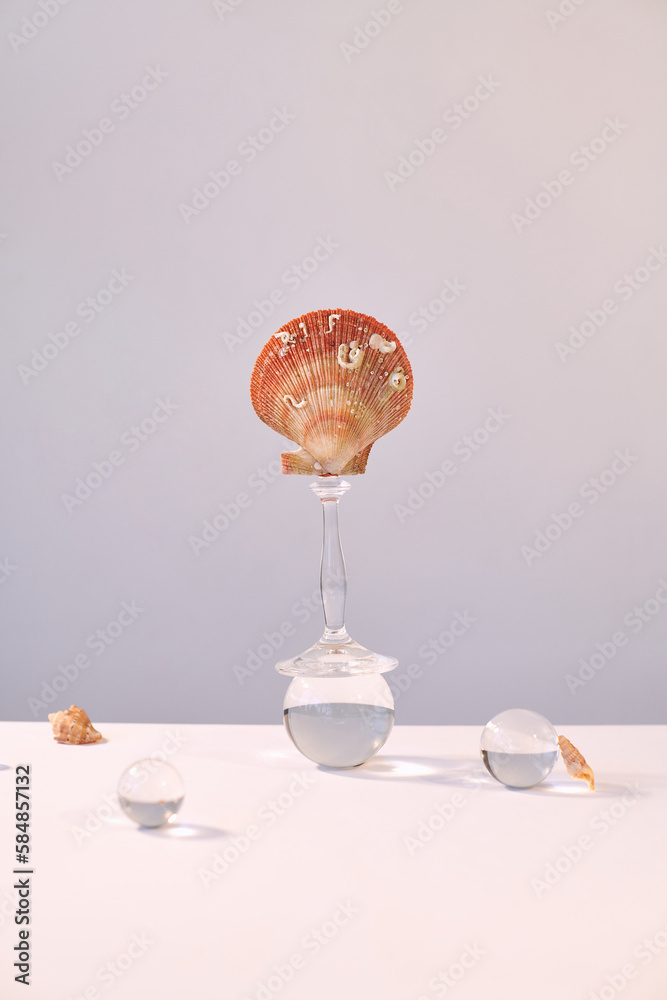 Abstract balancing composition of broken glass, ball and shell Stock ...