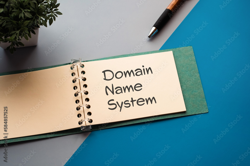 There is a notebook with the word Domain Name System. It is eye ...