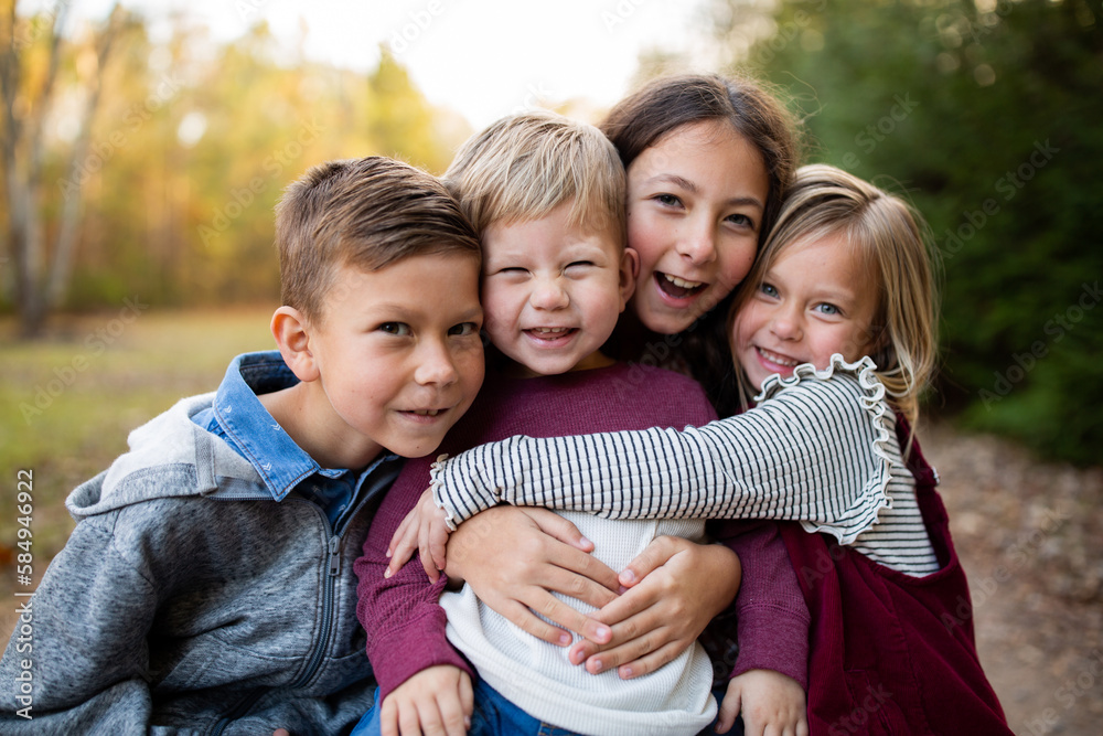 Four Happy Siblings Stock Photo | Adobe Stock