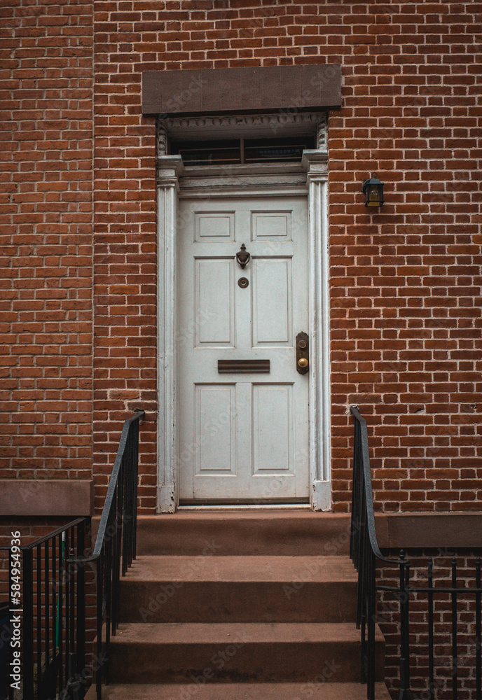 Entrance door of brick building Stock Photo | Adobe Stock
