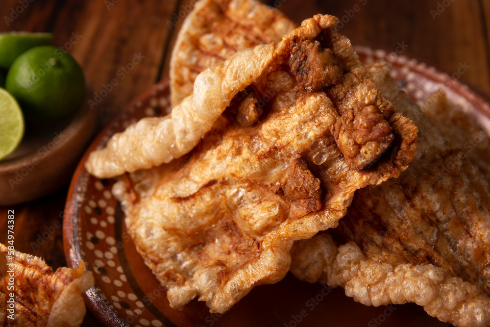 Chicharron. Crispy Fried pork rind, are pieces of aired and fried pork ...