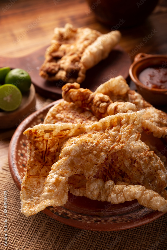 Chicharron. Crispy Fried pork rind, are pieces of aired and fried pork ...