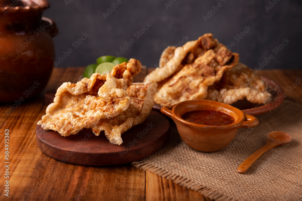 Chicharron. Crispy Fried pork rind, are pieces of aired and fried pork ...