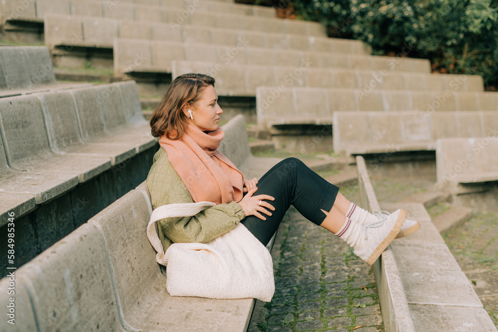 Woman resting outdoors Stock Photo | Adobe Stock