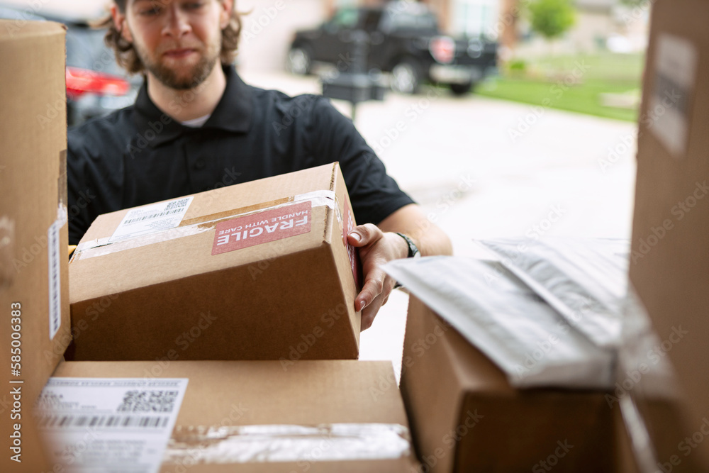 Shipment: Man Getting Boxes Out Of Delivery Van Stock Photo | Adobe Stock