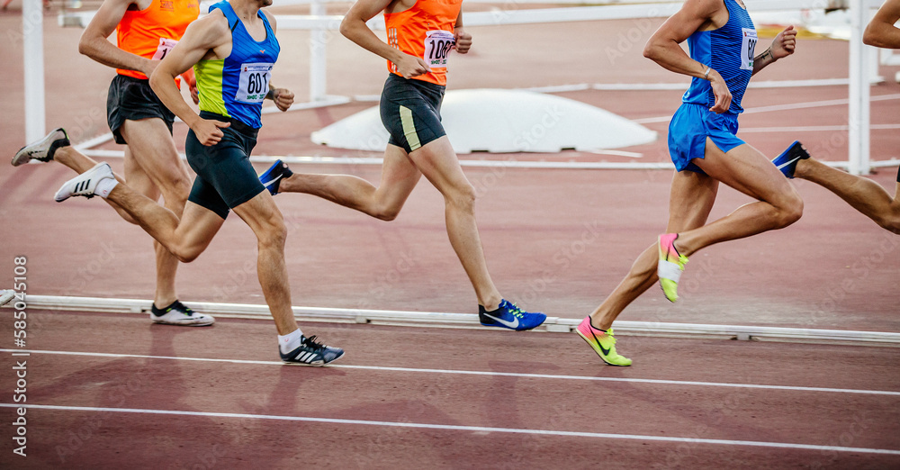 group runners athletes on middle distance run race, Nike and Adidas ...