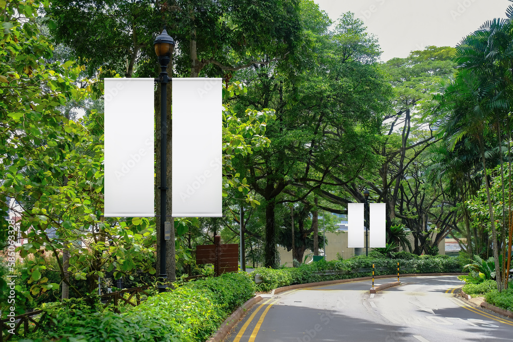 Blank vertical advertising banners on street lampposts; double hanging ...