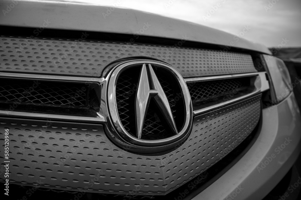 Acura logo on the front of the car. Acura emblem on the front bumper of ...