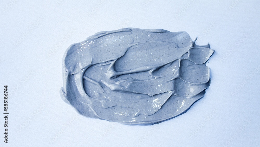 Body scrub texture with clay extract and core on a blue background ...