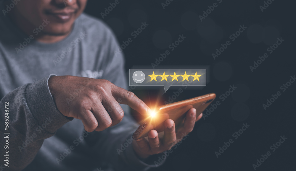 Businessman using smartphone to giving five-star symbol for highest ...