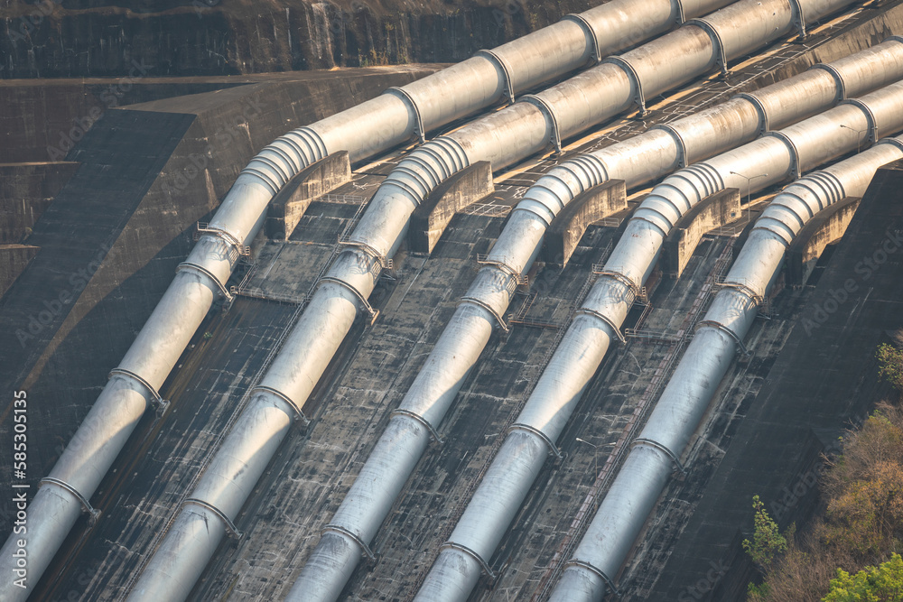 Huge metal pipeline structure on the electricity hydropower plant ...