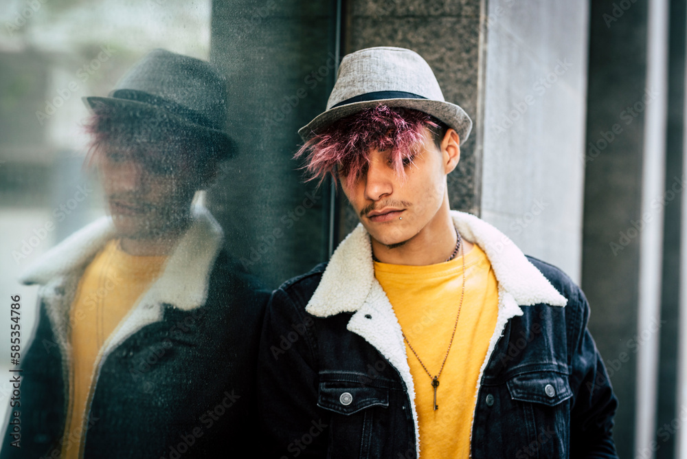 One sad boy teenager outdoor looking down for stress or depression ...