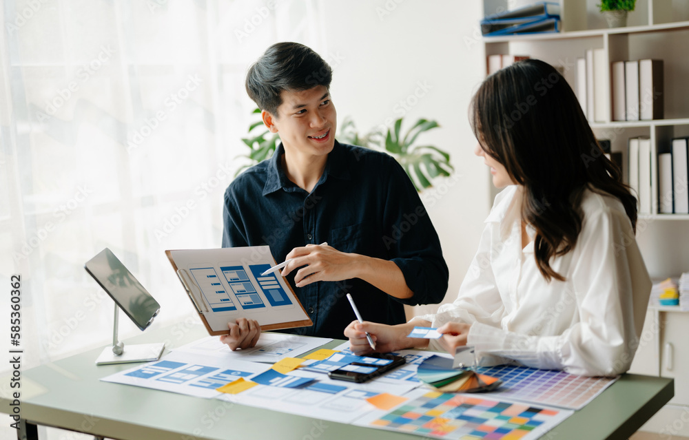 UX developer and ui designer brainstorming about mobile app interface ...