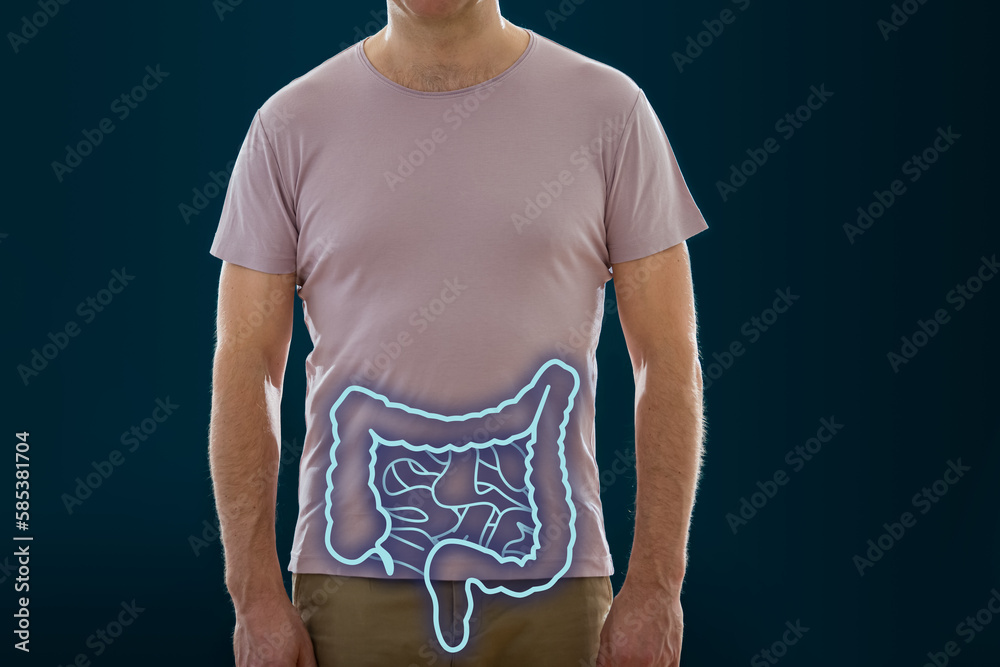 The man standing on a dark background. Picture of a human digestive ...