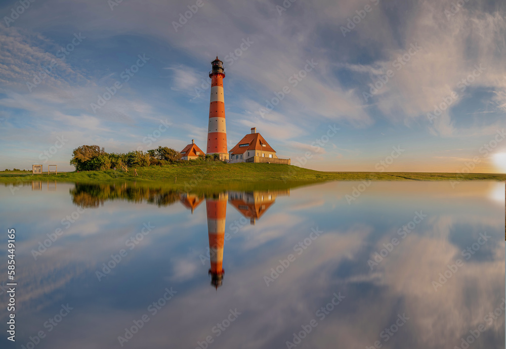 The Westerhever Lighthouse is an impressive beacon that rises high in ...