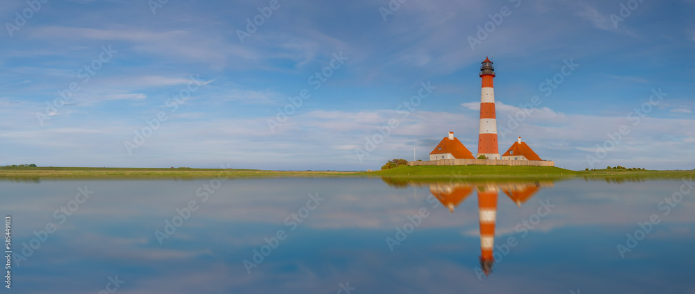 The Westerhever Lighthouse is an impressive beacon that rises high in ...