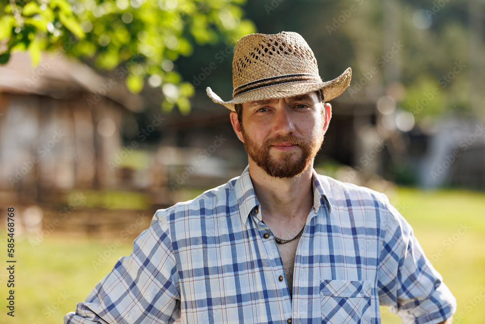Portrait of young Caucasian handsome bearded male farmer smiling to ...