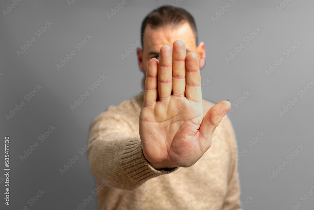 Hispanic man showing hands and palm lines forward with blurred body ...