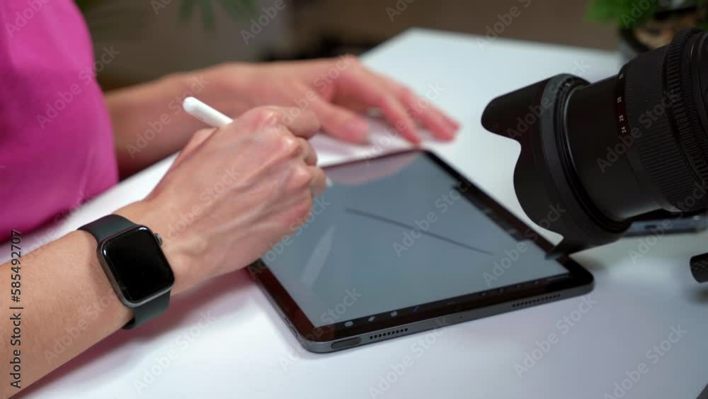 Camera captures the process of creating a drawing on a graphics tablet ...