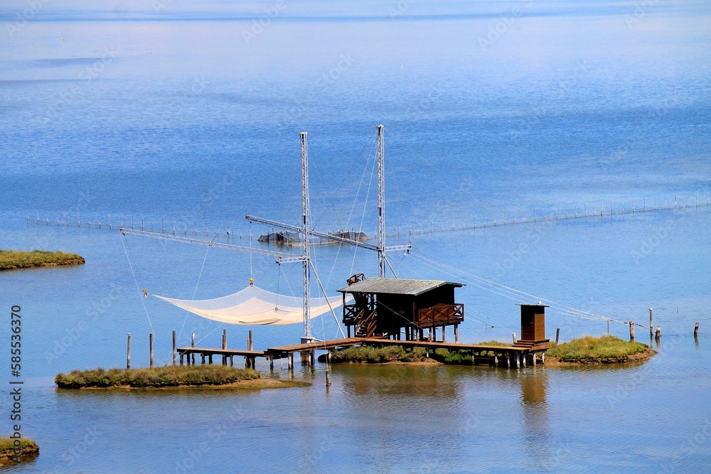 Traditional fishing hut on small island in the Venetian Lagoon between ...