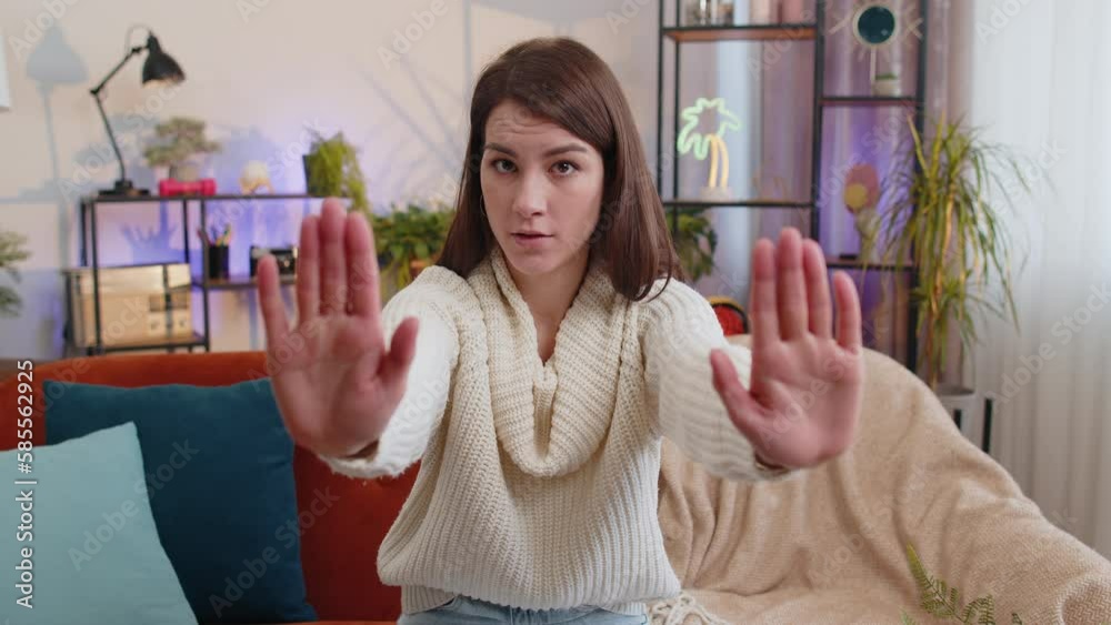 Stop gesture. Angry young woman say No hold palm folded crossed hands ...