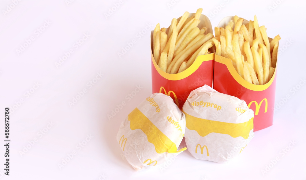 Kyiv, Ukraine - March 22, 2023: Two large portions of french fries and ...