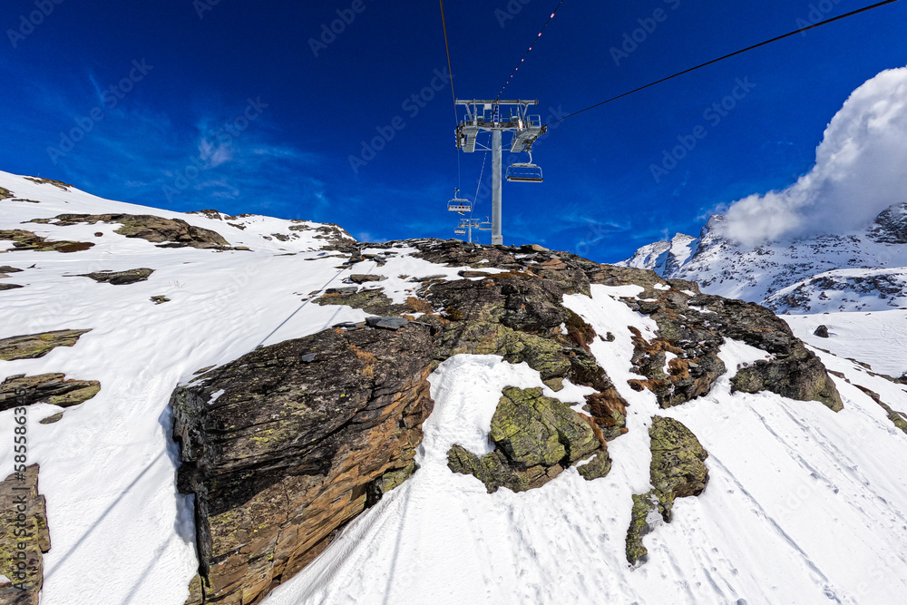 Chairlift post at the top of a snowy mountain above the Val Thorens ski ...