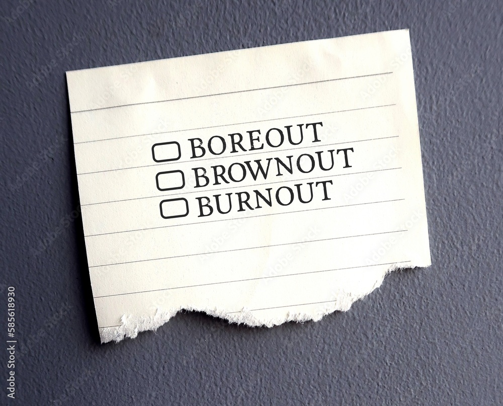 Paper note on office wall with checkboxes and handwritten words BOREOUT ...