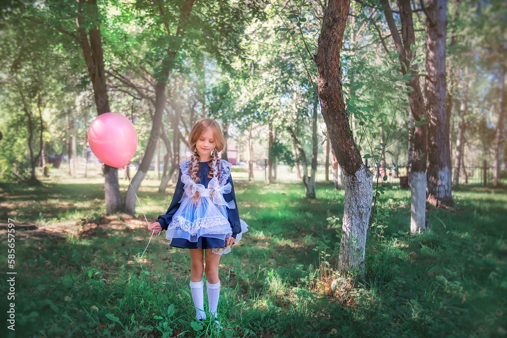 Little girl with long hair. First grader. Baby in school uniform ...