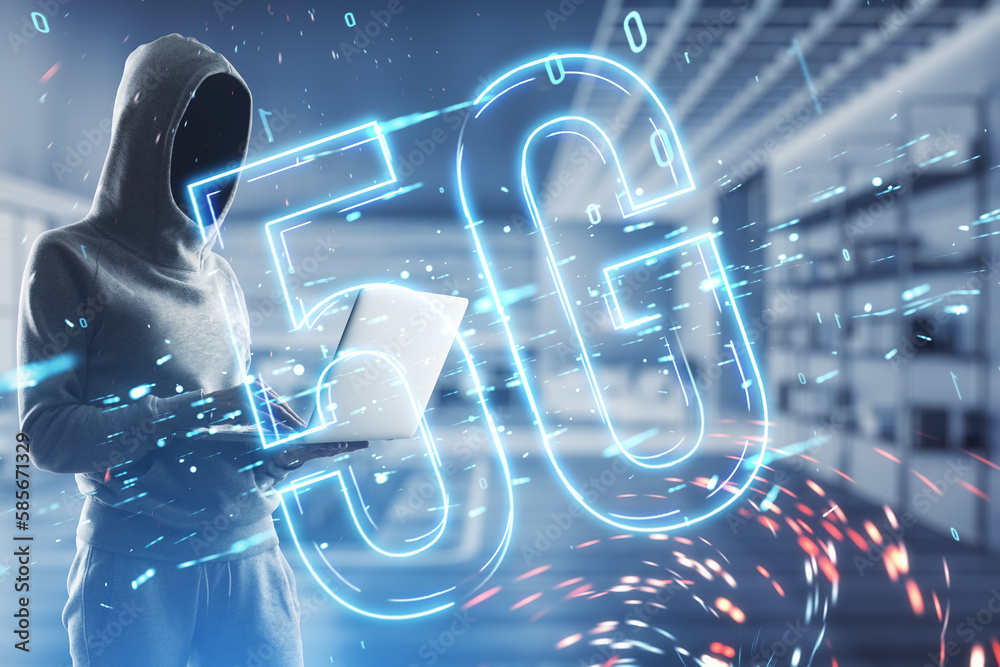 Hacker using laptop with glowing 5G hologram on blurry office interior ...