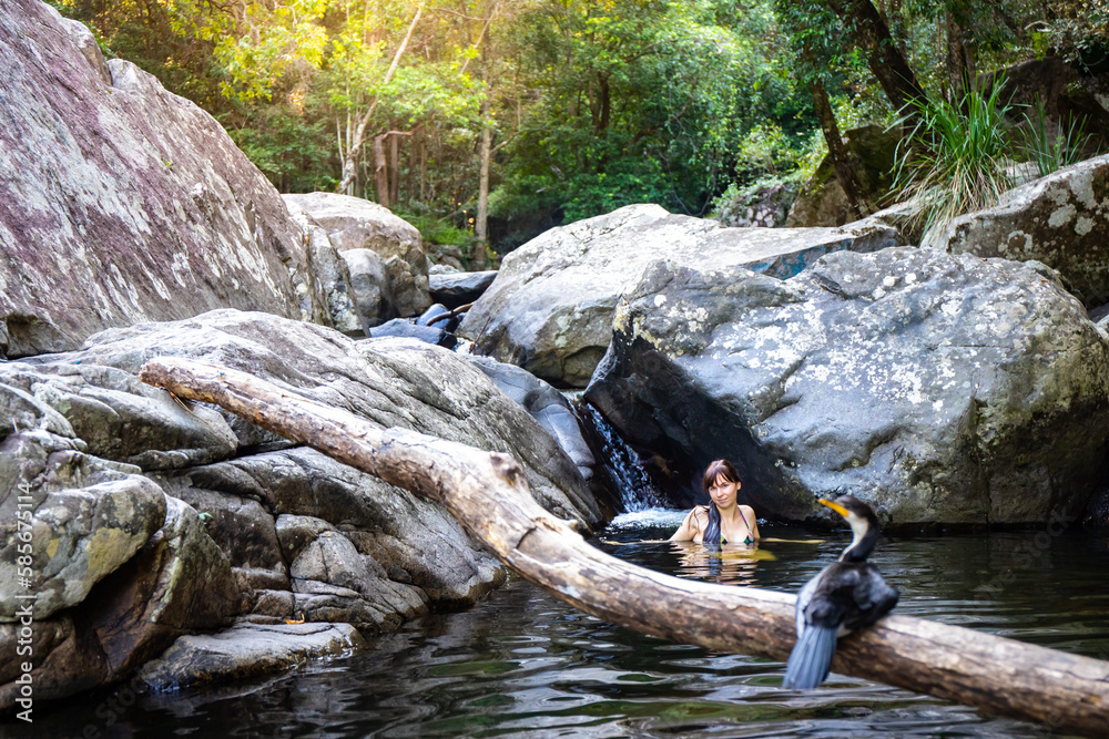 Beautiful girl takes a dip in cedar creek swimming holes and admires ...