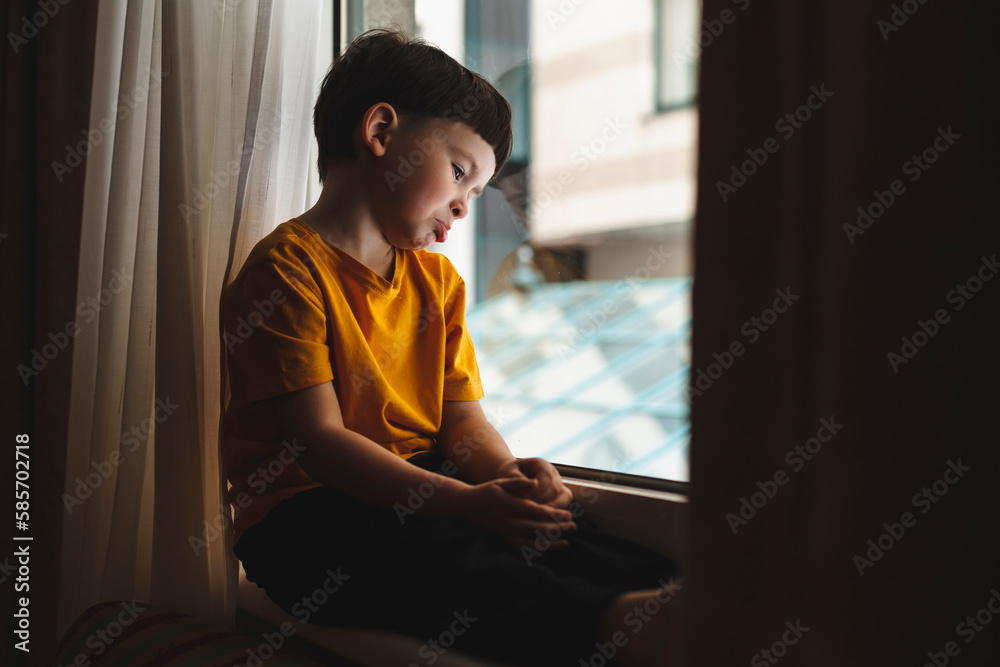 Portrait of sad and gloomy little boy sulking from disappointment ...
