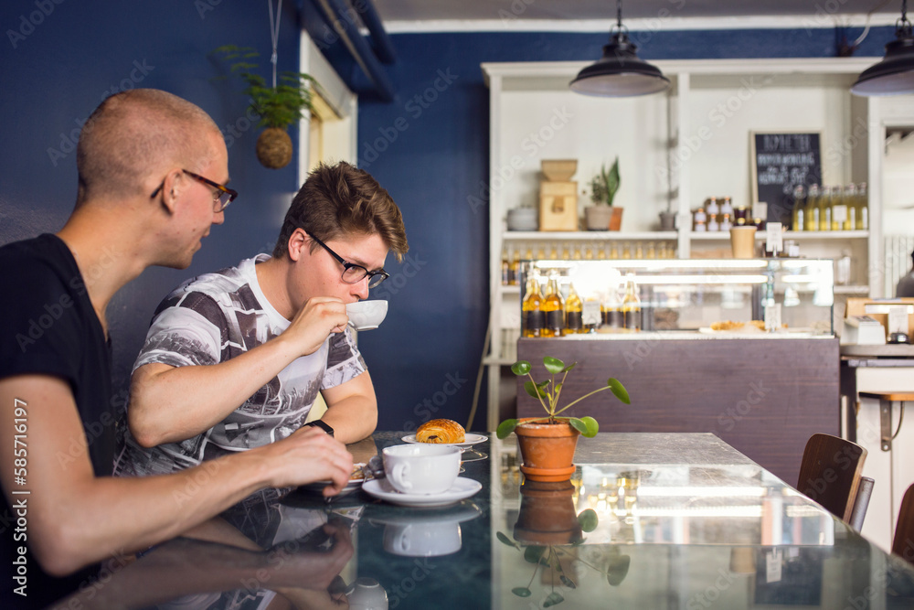 Customers enjoying fresh food and hot drinks in bakery Stock Photo ...
