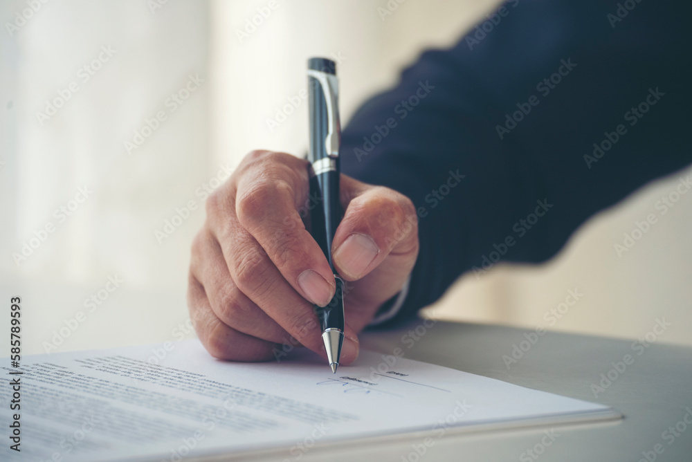Asian business man using pen signing on new contract to starting ...