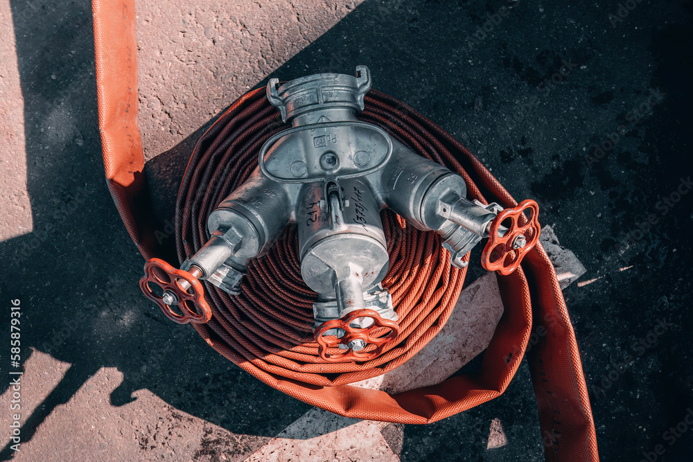 Fire hydrant splitter. Orange fire hose with connector. firefighting ...