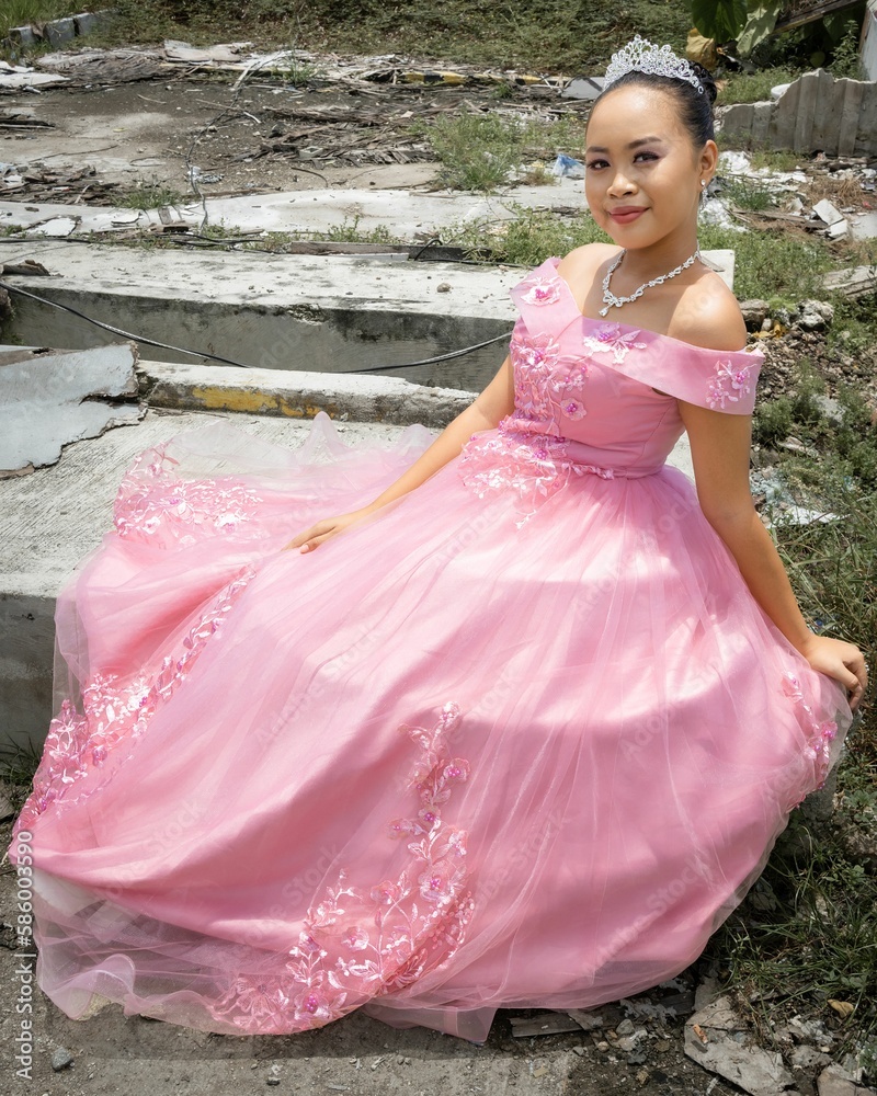 Philippine princess wearing a pink dress and a crown and sitting ...