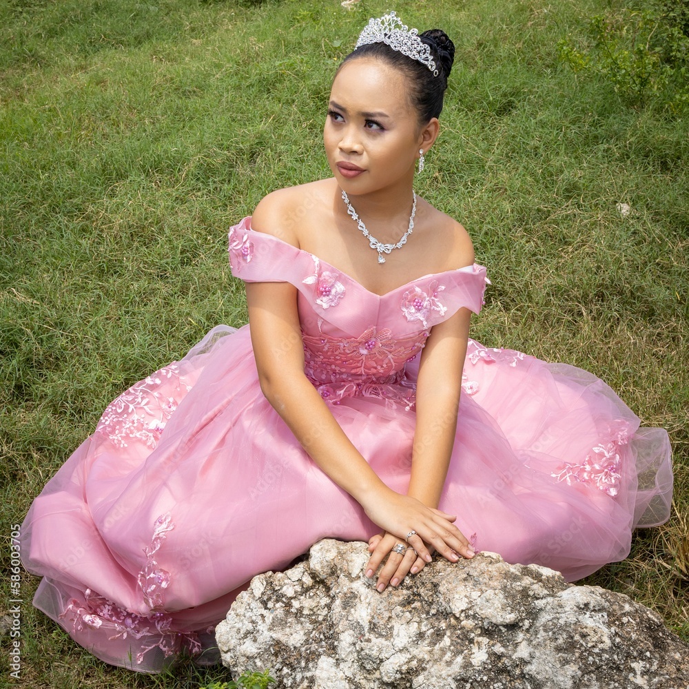 Philippine princess wearing a pink dress and a crown and sitting ...
