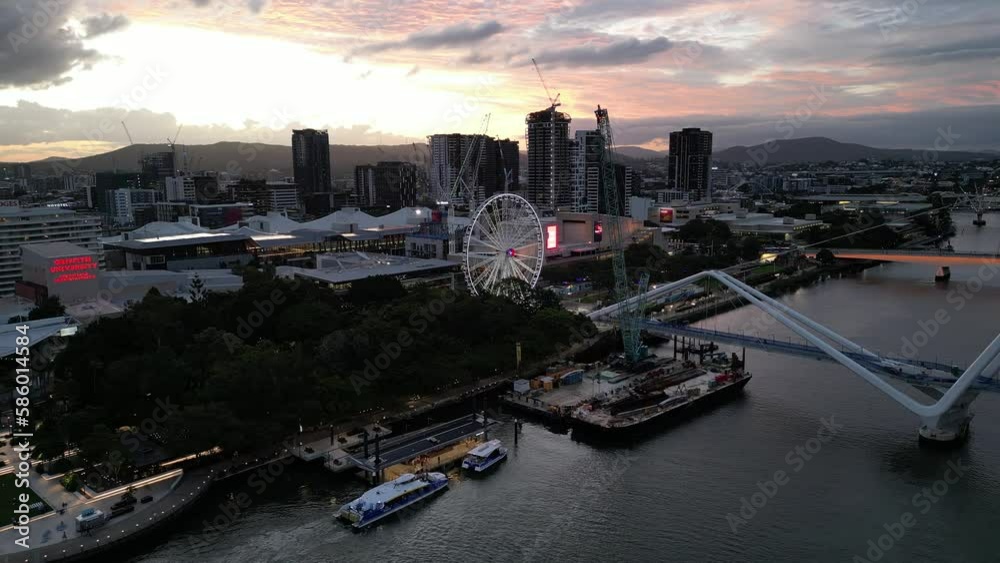 Drone shot of South Bank, shot over Brisbane River, camera tracking ...