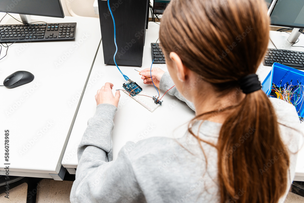 Teen student with Ultrasonic distance sensors diy robot on stem ...