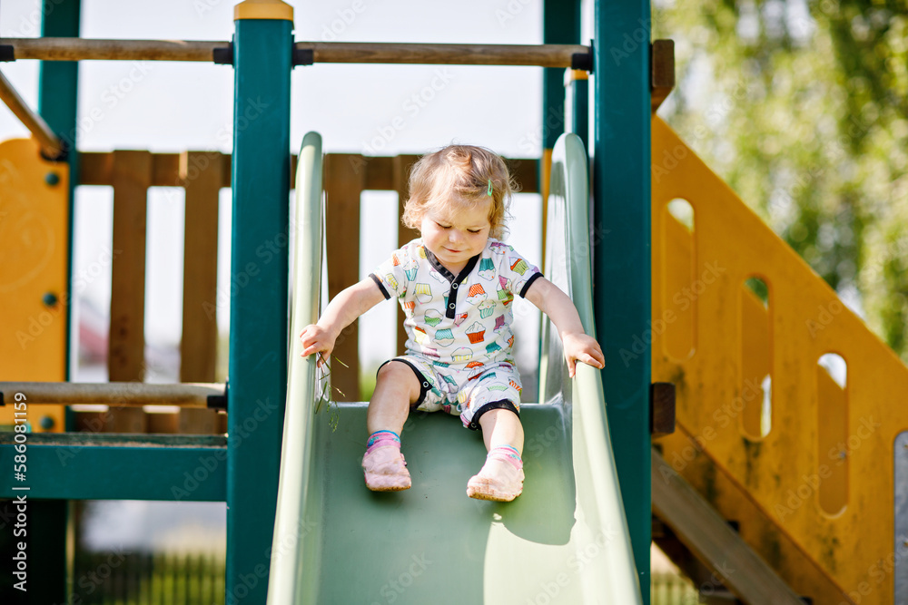 Happy Little Girl Sliding Fotolia