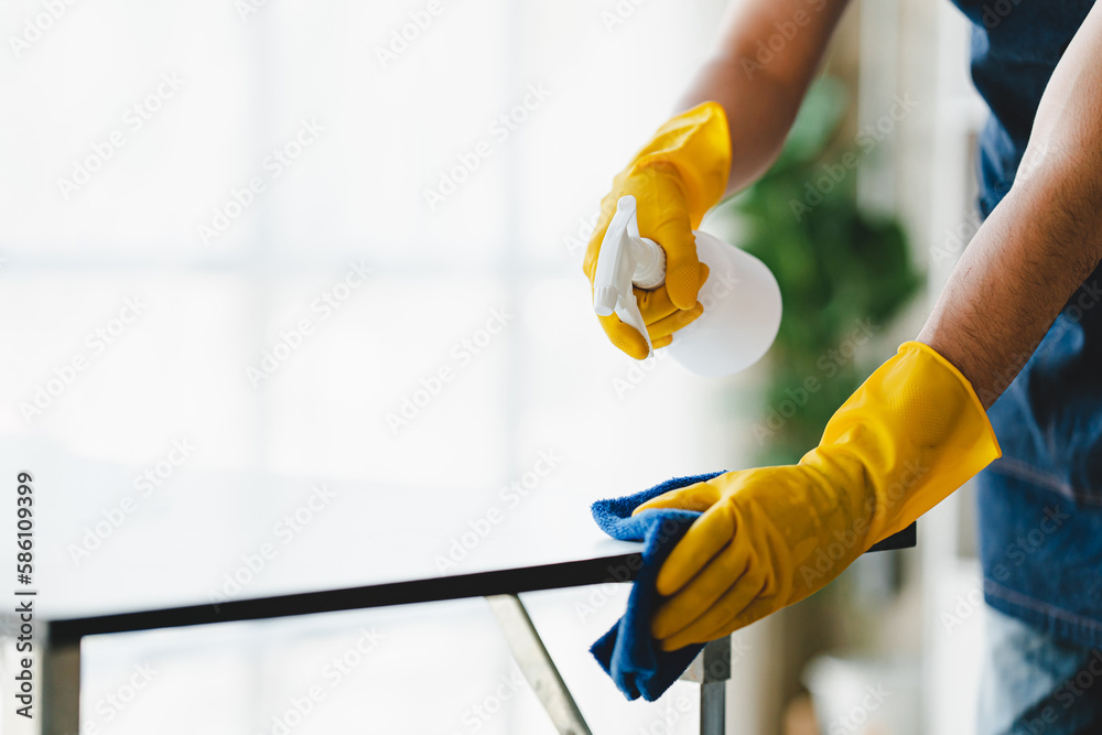 people doing cleaning are using cloths and spraying disinfectant Wipe ...