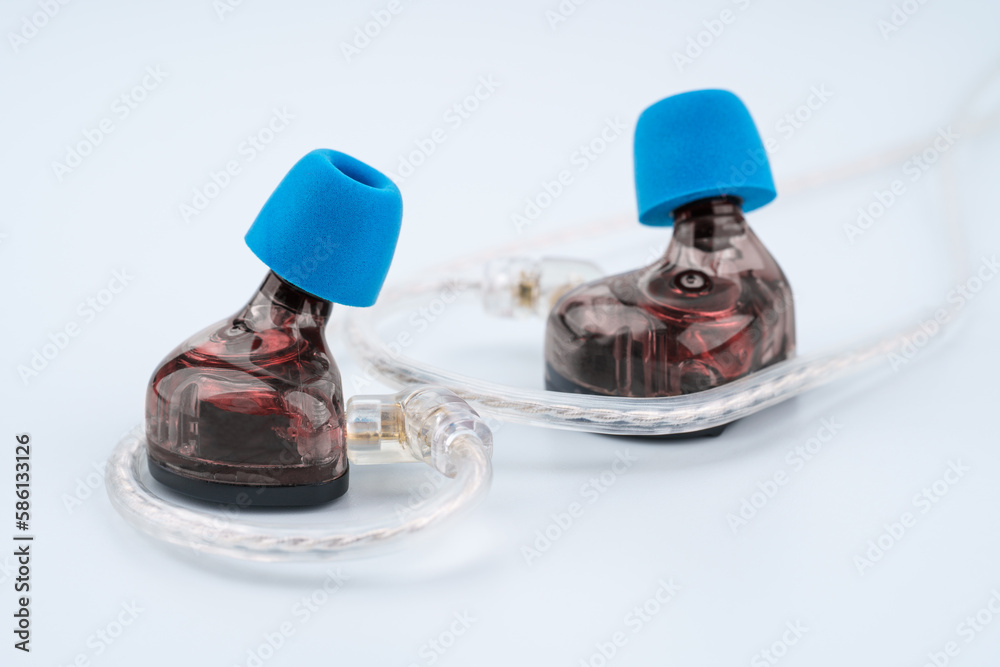In ear monitor on a tablature background. Custom in-ear monitors with ...