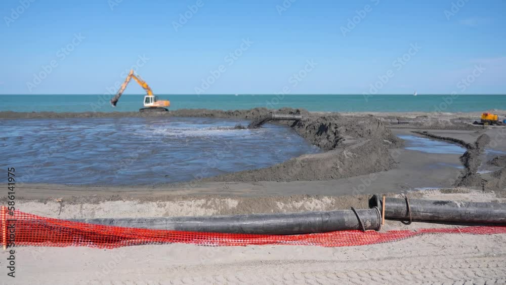 work in progress on the beach to move the sand with pressure pipes ...