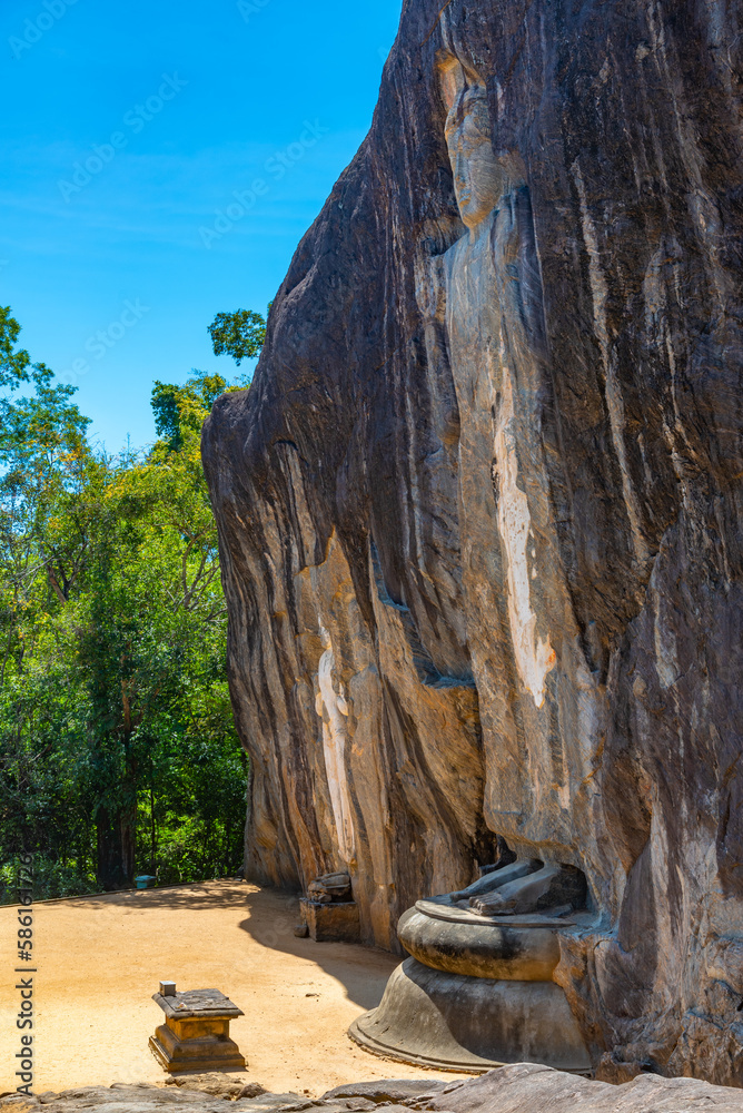 Buddha statues carved into stone at buduruwagala ancient site at Sri ...