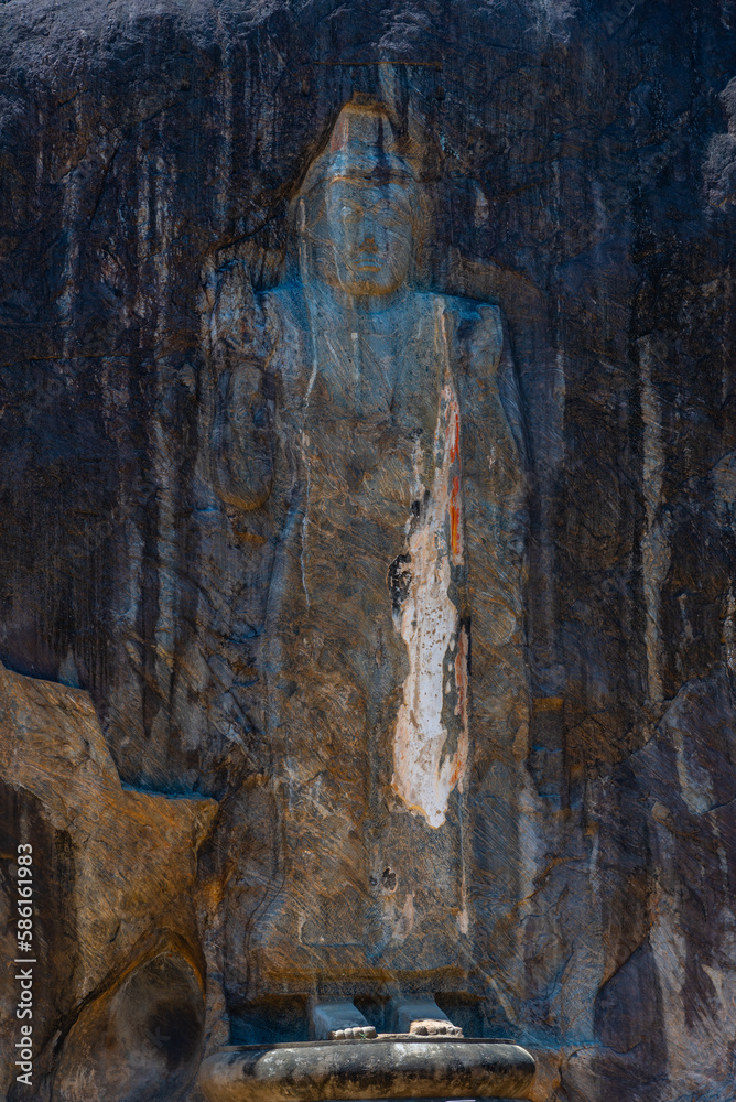 Buddha statues carved into stone at buduruwagala ancient site at Sri ...