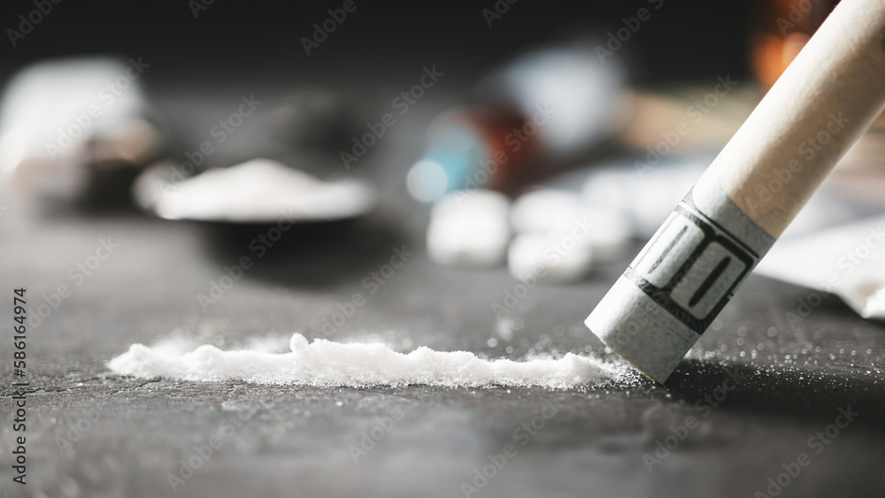 Snorting cocaine, white powder line, rolled up dollar bill, white pills ...