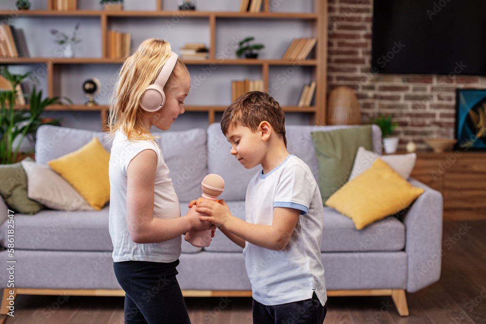 Two children sing song. Concept is childhood, vocal, music, singing ...