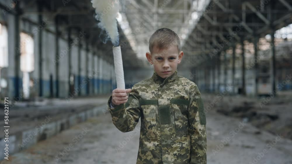 Boy Soldier Wearing Military Uniform Holding a White Smoke Bomb in the ...